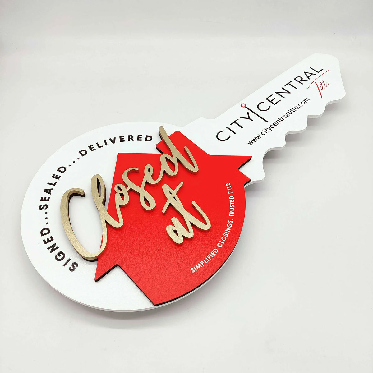 Realtor Orange Key Sign with a Wooden House – Real Estate Store