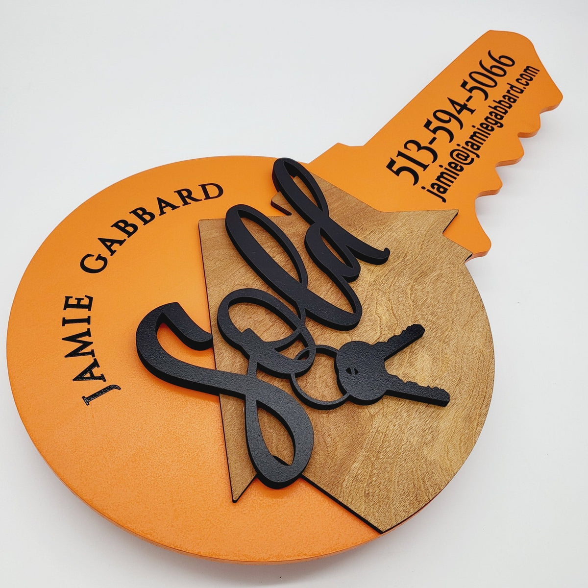 Realtor Orange Key Sign with a Wooden House – Real Estate Store